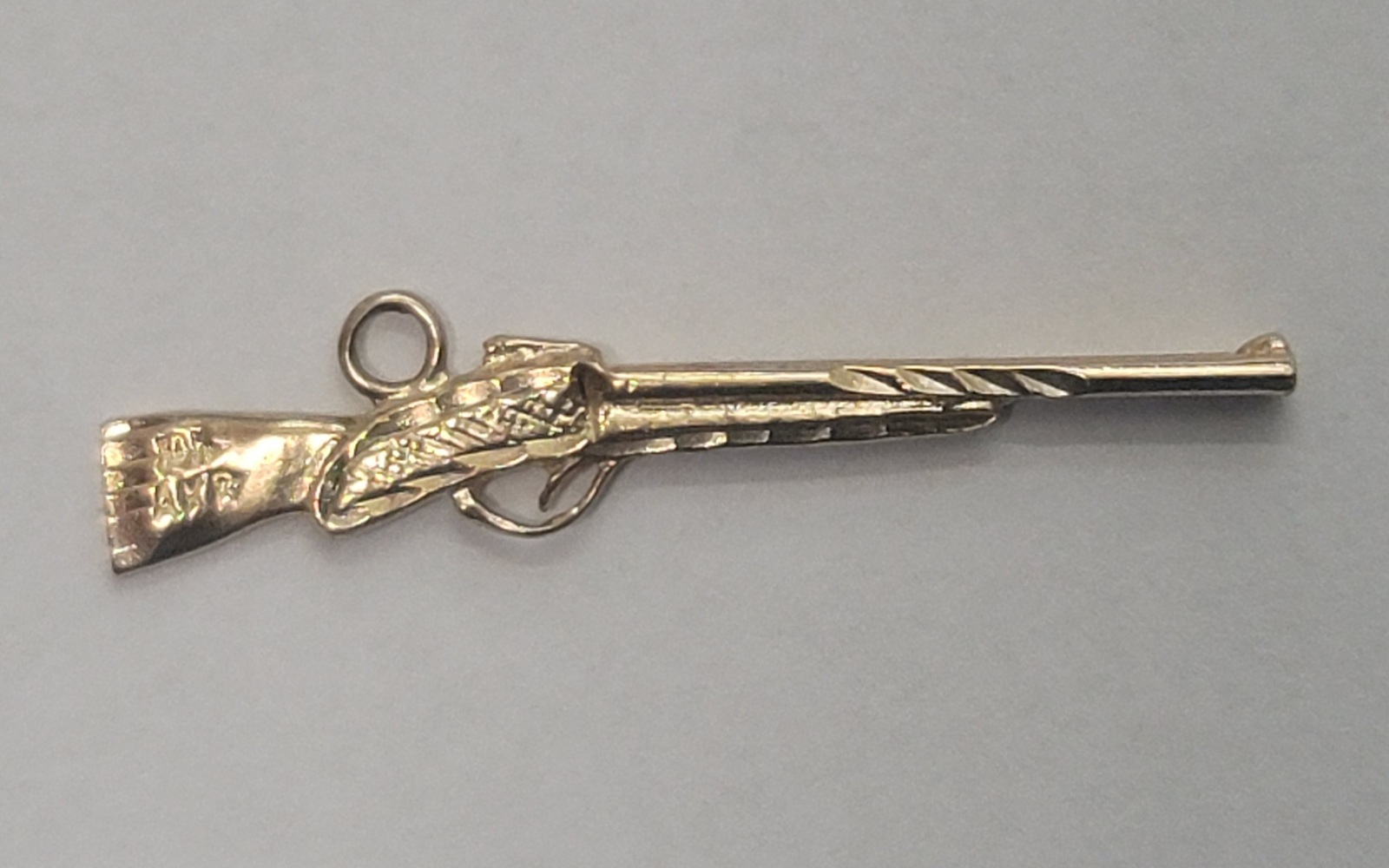 10 Karat Yellow Gold Rifle Charm Pendant | Avenue Shop Swap & Sell